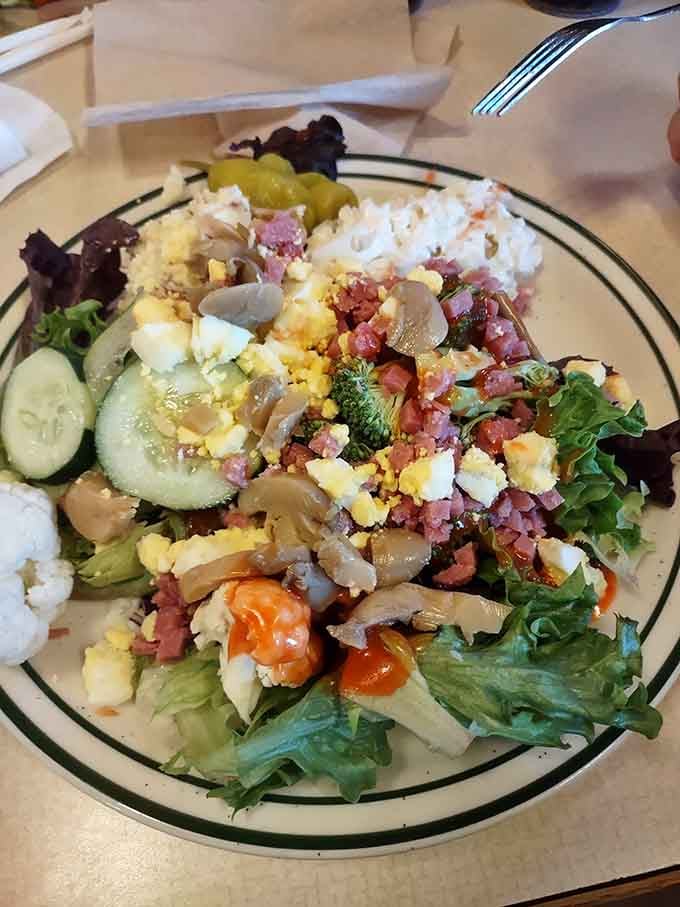 This salad bar masterpiece shows someone who understands that vegetables deserve the same enthusiasm as everything else here.
