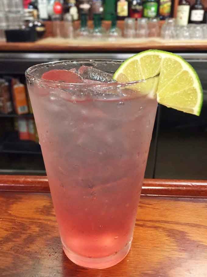 A refreshing cocktail with that perfect lime garnish makes the buffet experience feel like a proper celebration.