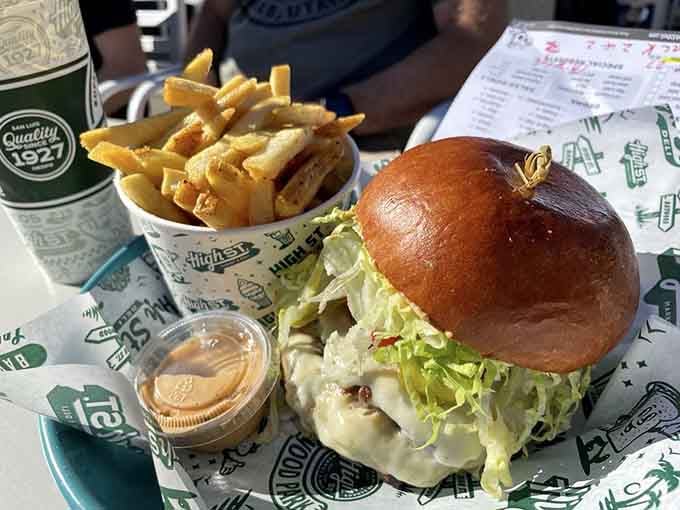 That brioche bun cradles a burger so loaded with toppings, structural engineering might've been involved.