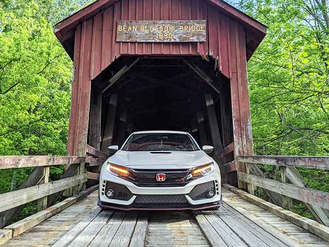 Modern car meeting a historic bridge creates the kind of time-travel photo your phone was made for.