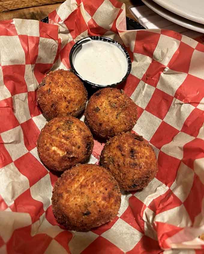 These golden-fried Buffalo chicken balls come with ranch dressing, ready to make your taste buds sing the hallelujah chorus.