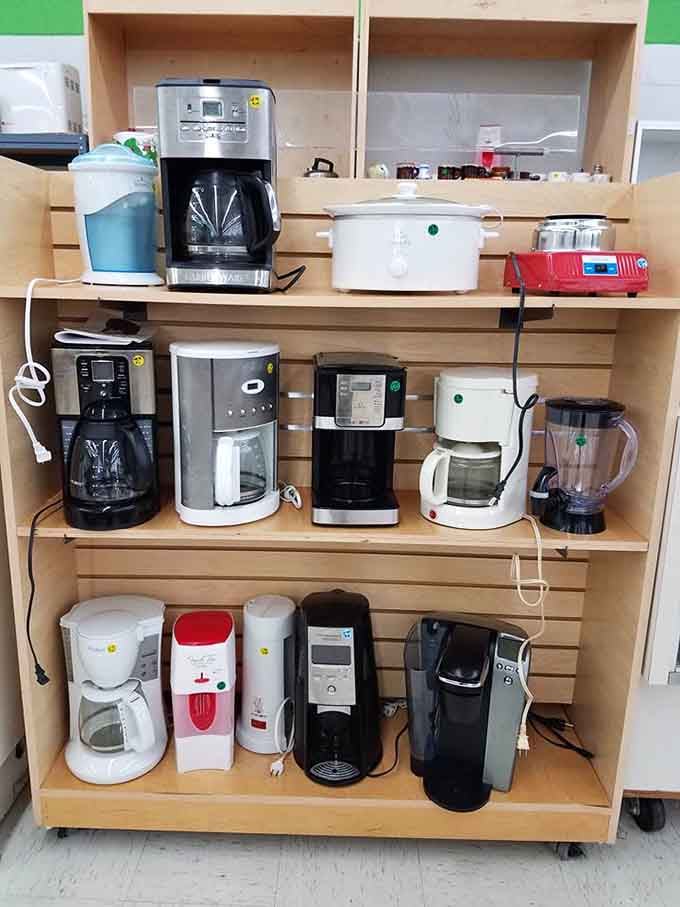 An entire coffee maker convention happening on these shelves, each one ready to brew your morning salvation.
