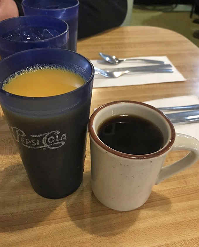 Fresh orange juice and hot coffee in classic diner mugs start your morning exactly the right way.