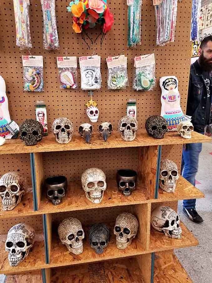 Decorative skulls grin from their wooden perch, proving that memento mori can be surprisingly cheerful when properly displayed.