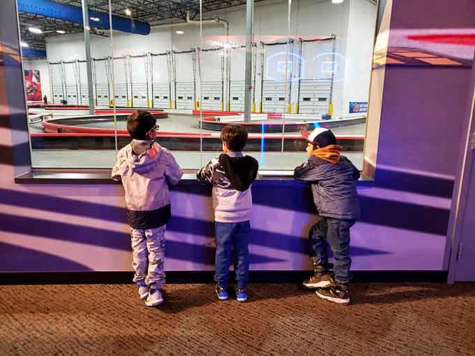 Future racing champions studying the track like they're planning a heist in an Ocean's Eleven movie.