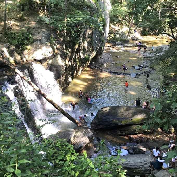 Summer brings families to this natural swimming hole, where laughter echoes off the rocks like a joyful symphony.