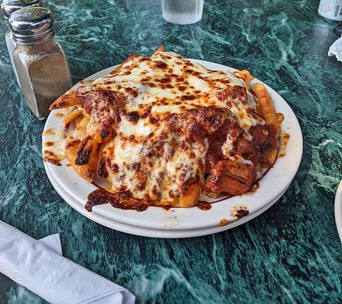 Polish poutine takes comfort food international with layers of cheesy, saucy goodness piled impossibly high.