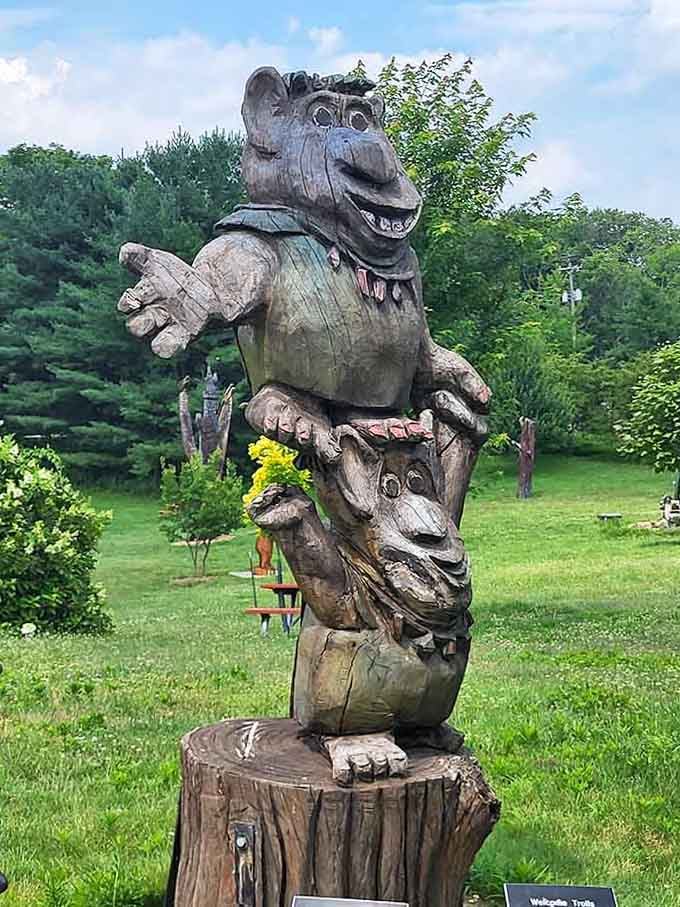 That troll face carved into the tree trunk is either welcoming you warmly or plotting mischief, possibly both simultaneously.