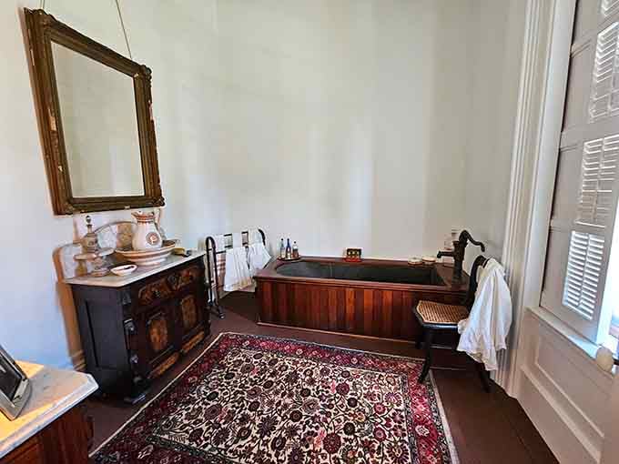 That wooden bathtub surrounded by marble and Persian rugs proves luxury bathing existed long before jacuzzi jets were invented.