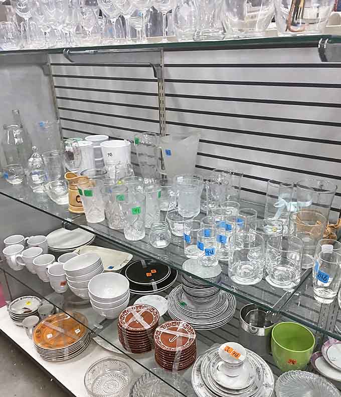 Glassware and dishes stacked high, perfect for anyone who's ever broken a favorite glass and mourned appropriately.