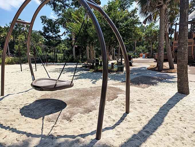 Modern swing sets nestled in sand offer timeless joy, because some childhood pleasures never need updating or improvement whatsoever.