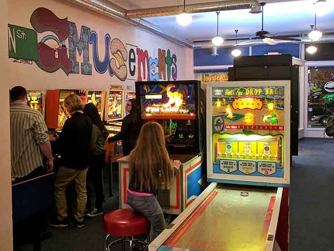 Classic arcade cabinets and vintage games create the perfect playground where generations collide in the best way possible.