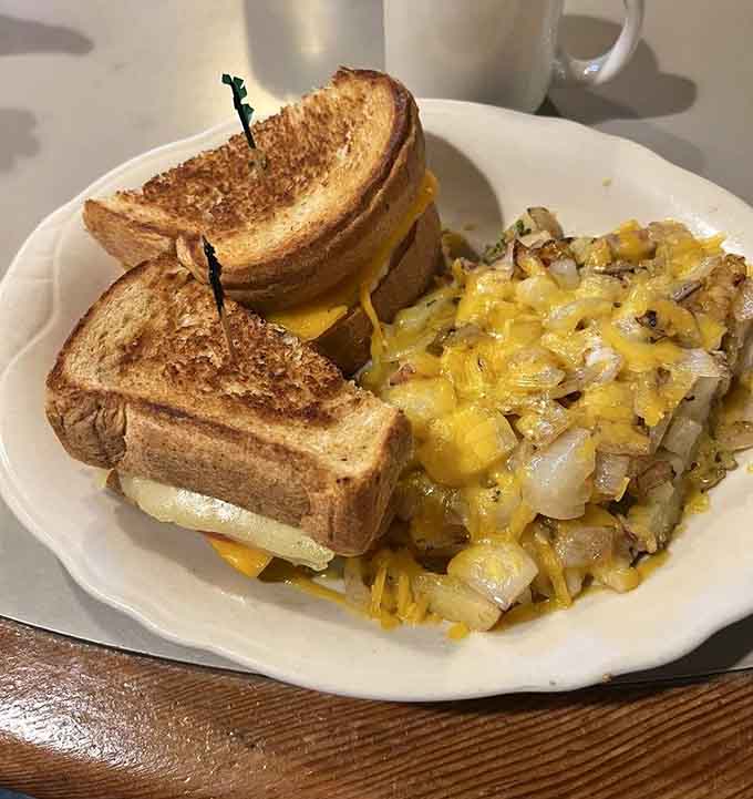 Golden toast towers and melted cheese with perfectly seasoned potatoes prove breakfast sandwiches can be architectural marvels too.