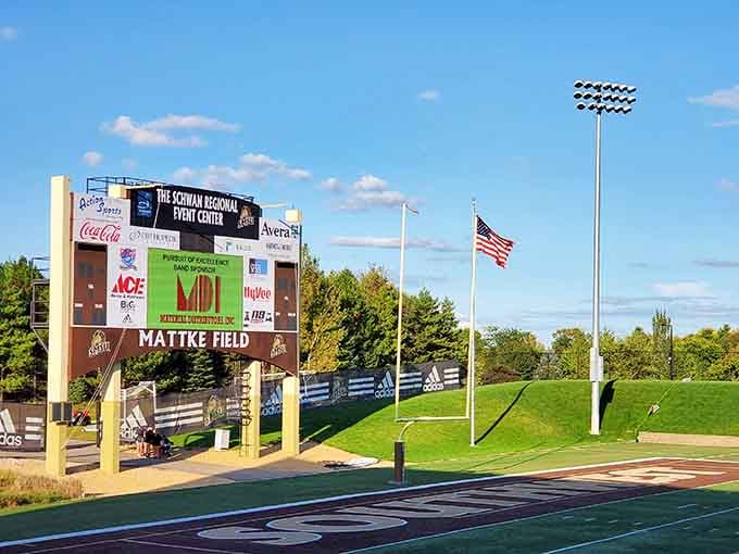 Athletic fields host community sports where participation doesn't cost more than a used car payment.