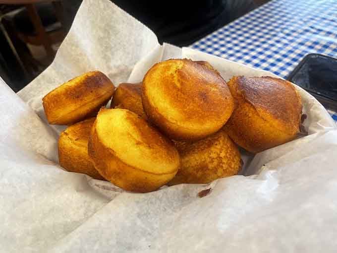 Fresh cornbread that's golden, fluffy, and begging for a pat of butter to complete the experience.