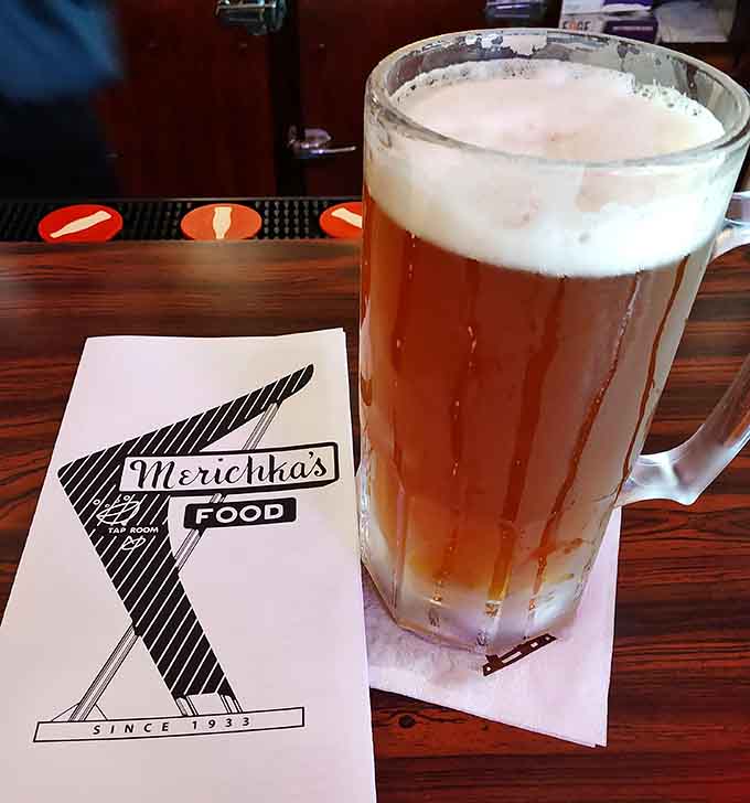 A perfectly poured beer in a frosty mug, the ideal companion for whatever deliciousness you just ordered.