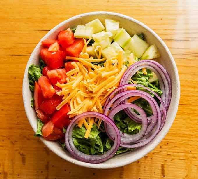 Fresh vegetables arranged like edible art prove that salads can be beautiful and satisfying simultaneously.