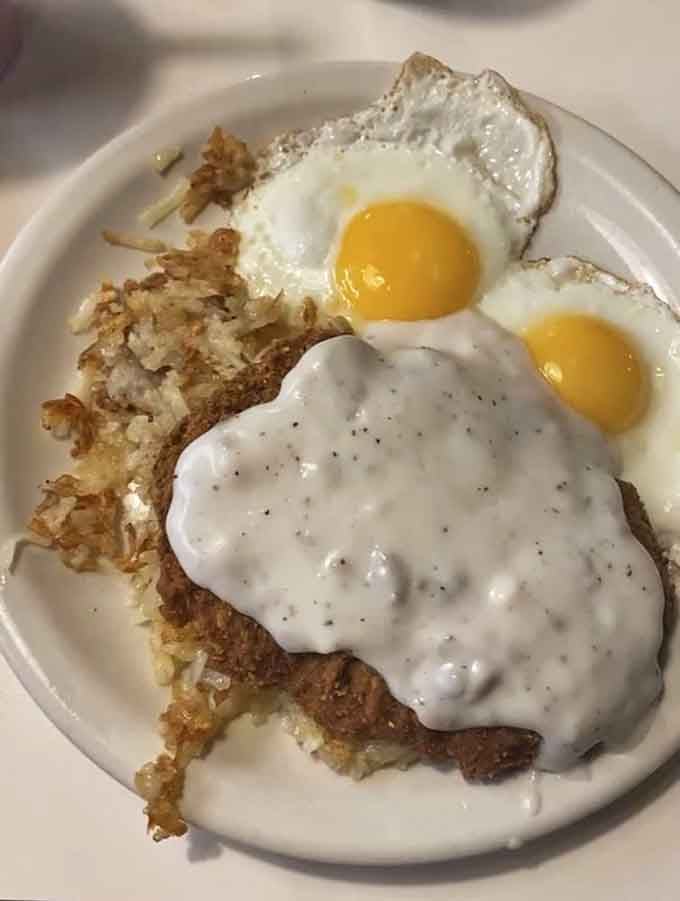 Country fried steak smothered in gravy with eggs and hash browns: breakfast as it was meant to be experienced.