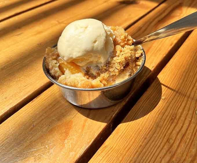 Peach cobbler topped with vanilla ice cream, because sometimes dessert needs to be its own separate meal.