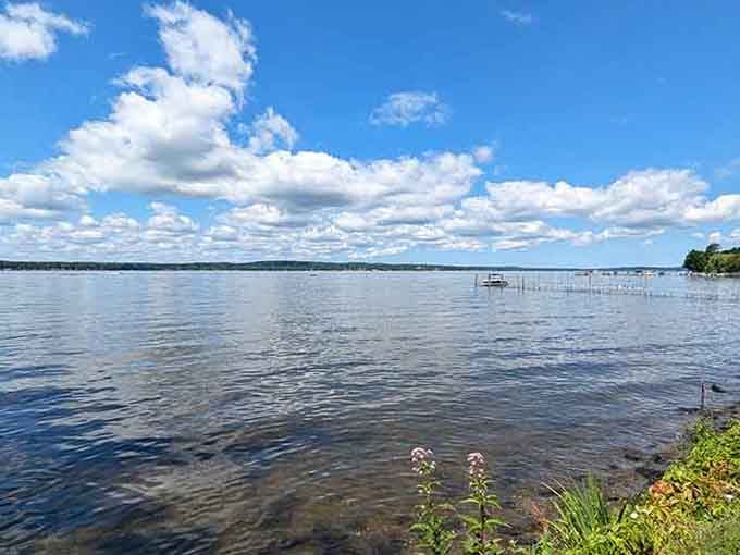 Chautauqua Lake stretching toward the horizon under cotton-candy clouds, offering the kind of tranquility that makes you forget your phone exists.