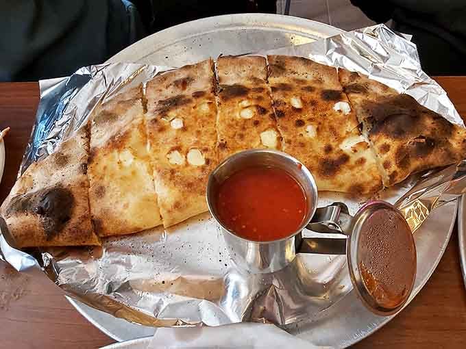 Golden, puffy, and stuffed with three cheeses, this calzone is basically a warm hug from an Italian grandmother.