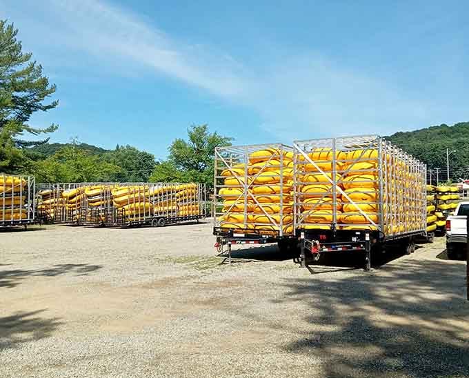 Stacks of yellow kayaks ready for action, like a fleet preparing for the world's most enjoyable invasion.