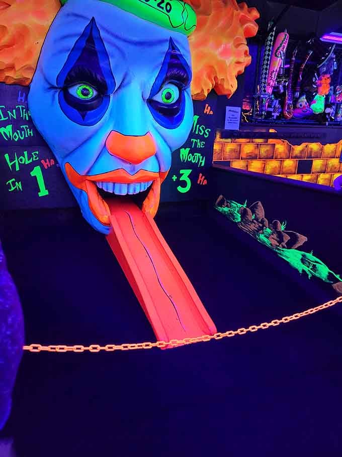 That tongue-slide obstacle proves mini golf designers have a delightfully twisted sense of humor we can all appreciate.