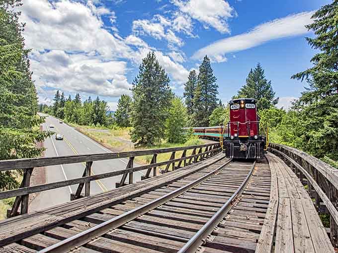 The locomotive waits patiently while rail bikers get their turn on these storied tracks.