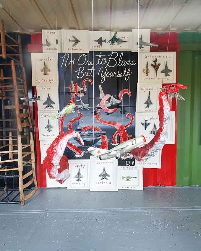 That crimson octopus wrapping around fighter jets delivers a message we all need, wrapped in surreal humor and tentacles.
