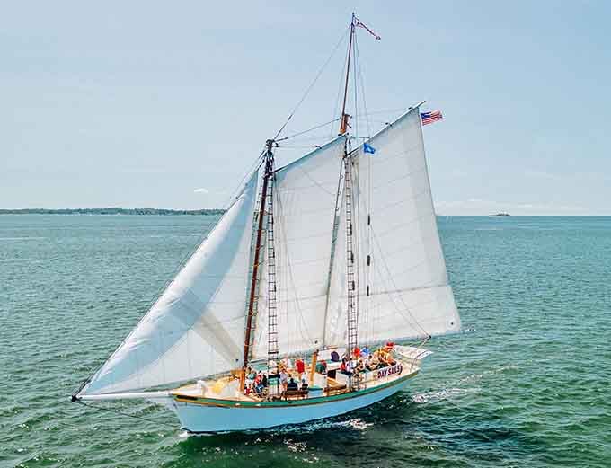 Full sails catching wind on open water&mdash;the kind of sight that makes landlubbers reconsider their life choices immediately.
