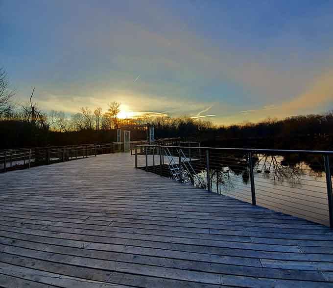 Sunset paints the sky while the boardwalk offers front-row seats to nature's nightly performance finale.