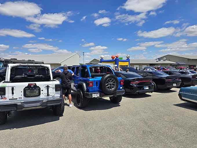 The parking lot fills with everything from minivans to muscle cars, united by speed appreciation.