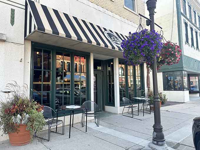 Lola's striped awning and sidewalk seating invite you to slow down and enjoy small-town cafe culture.