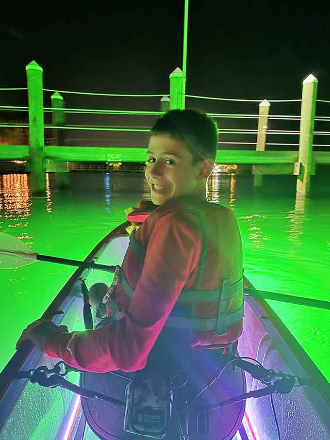 Pure joy looks like a kid in a light-up kayak discovering that nighttime adventures beat video games.