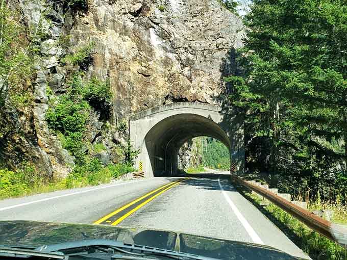 Rock tunnels carved through mountainsides remind you that building this highway was no small feat of determination.