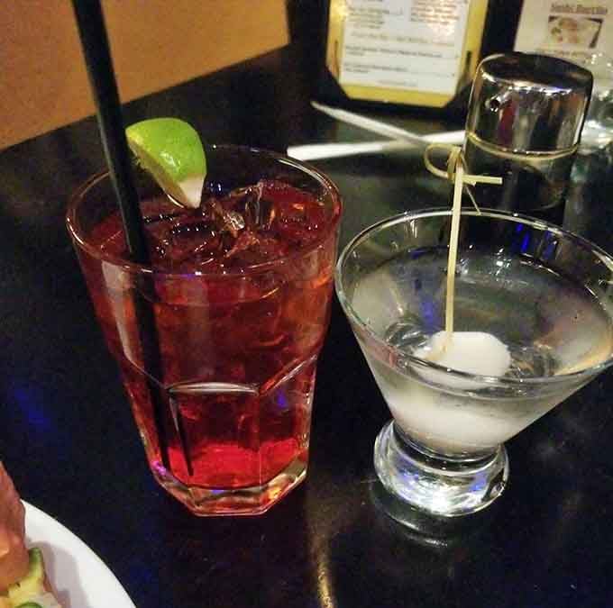A ruby-red cocktail and pristine martini sitting side by side, the perfect liquid companions for your sushi adventure ahead.