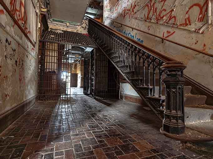 Ornate staircases and iron railings prove that even prisons once had architectural ambition, though inmates probably didn't appreciate the craftsmanship.