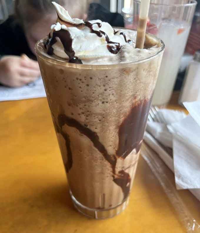 Mocha frappe topped with whipped cream and chocolate drizzle, the kind of indulgence that makes afternoon breaks worthwhile.