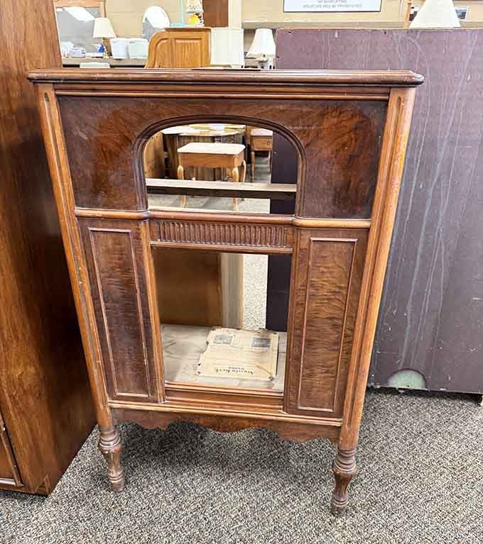 This vintage radio cabinet has more character than most modern furniture, and it probably still works better than your WiFi.