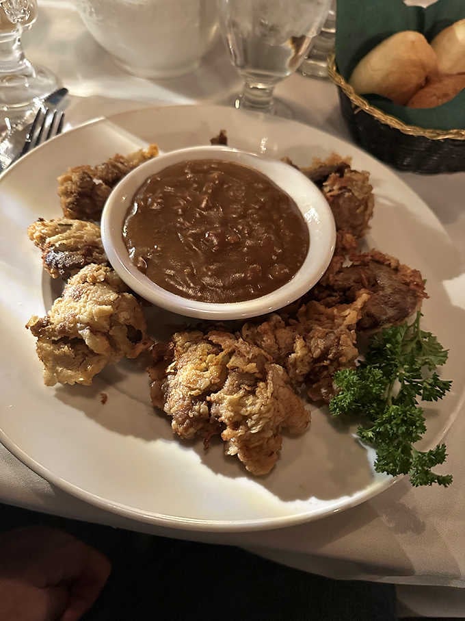 Golden fried chicken livers with sauce prove Pat's doesn't play favorites between land and sea delicacies.