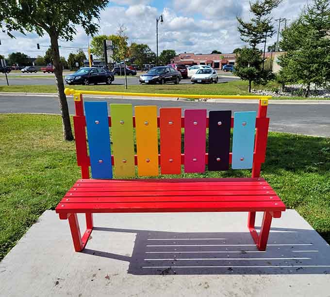 Even the bench here is cheerful, painted in rainbow hues that brighten any lakeside afternoon perfectly.