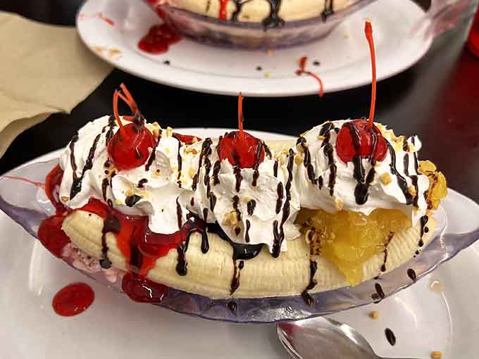 Three scoops, whipped cream, cherries, and enough toppings to make your inner child do a happy dance.