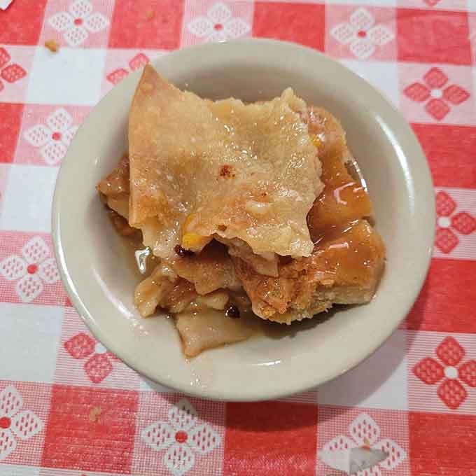 Peach cobbler with a flaky crust swimming in sweet fruit is the dessert equivalent of a warm hug from your favorite grandmother.