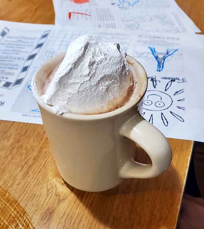 A mug of hot chocolate crowned with whipped cream: simple, generous, and completely wonderful.