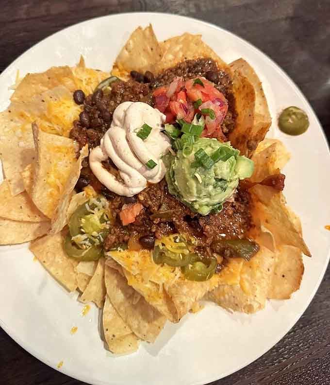 This mountain of tortilla chips loaded with toppings could feed a small book club with plenty left over.