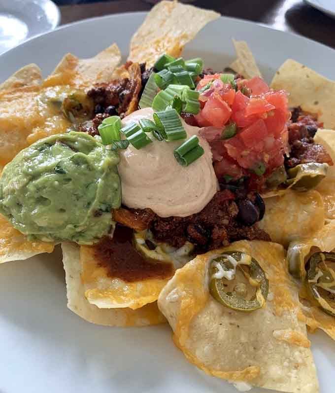 These nachos arrive piled higher than Poe's collected works, and they're significantly easier to finish in one sitting.