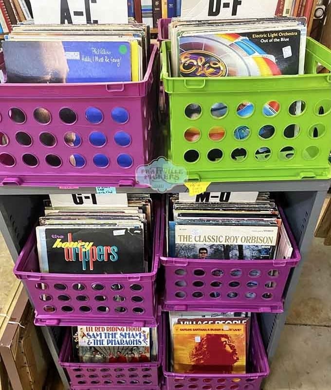Vinyl records organized in cheerful crates, because Electric Light Orchestra sounds better when you find it by accident.