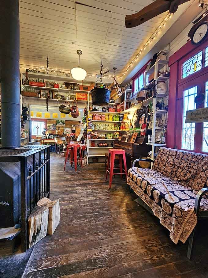 That wood stove and vintage couch invite you to sit, stay, and pretend you live in a simpler time.