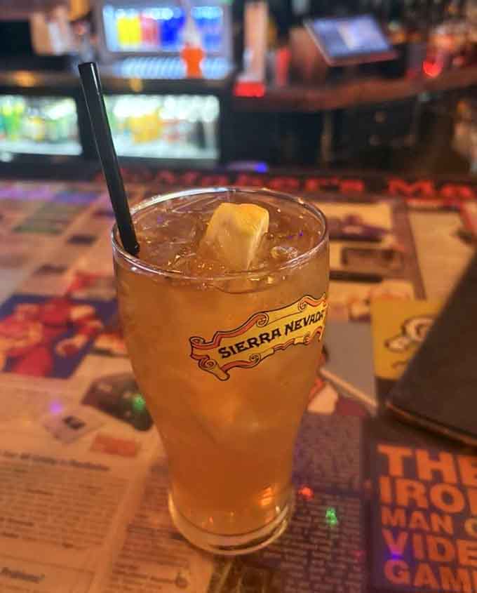 A perfectly crafted cocktail sits ready for action, because gaming marathons require proper hydration and adult beverages in equal measure.