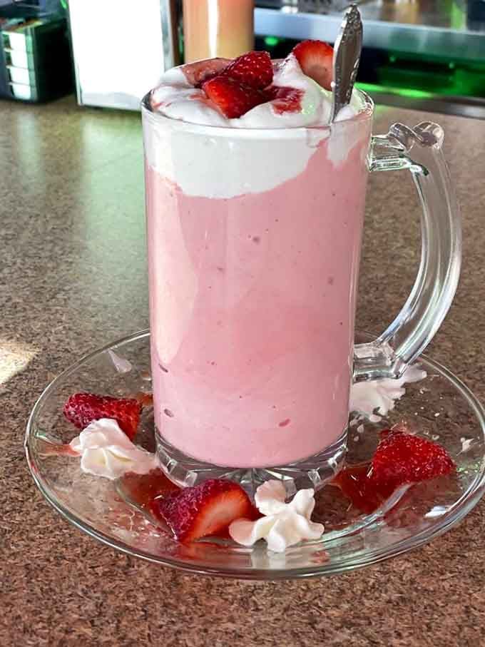 This strawberry shake in a frosty mug comes garnished with fresh berries and enough whipped cream to justify the trip.